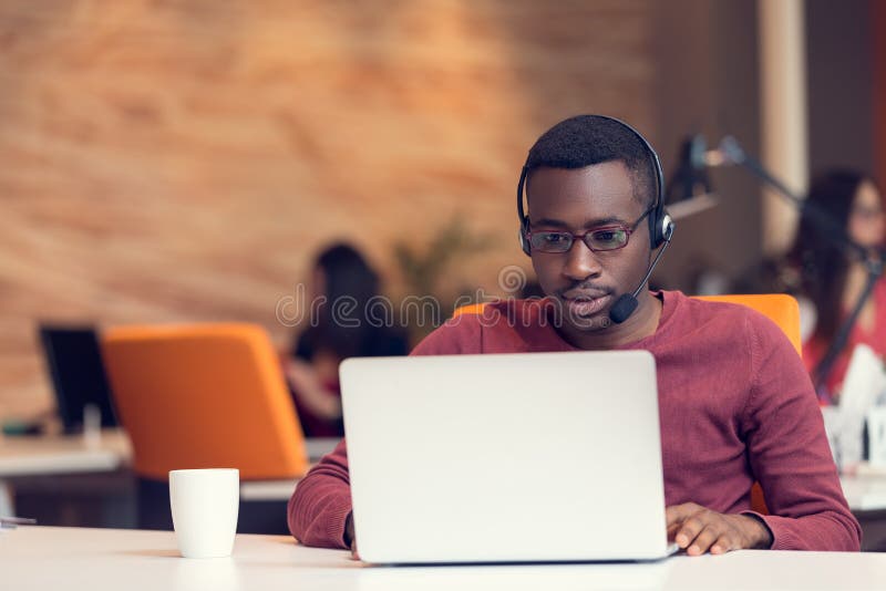 Customer Service Agent in an Startup Office with Laptop Stock Image ...