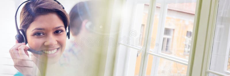 Customer Service Assistants With Headsets With Bright Window Background ...