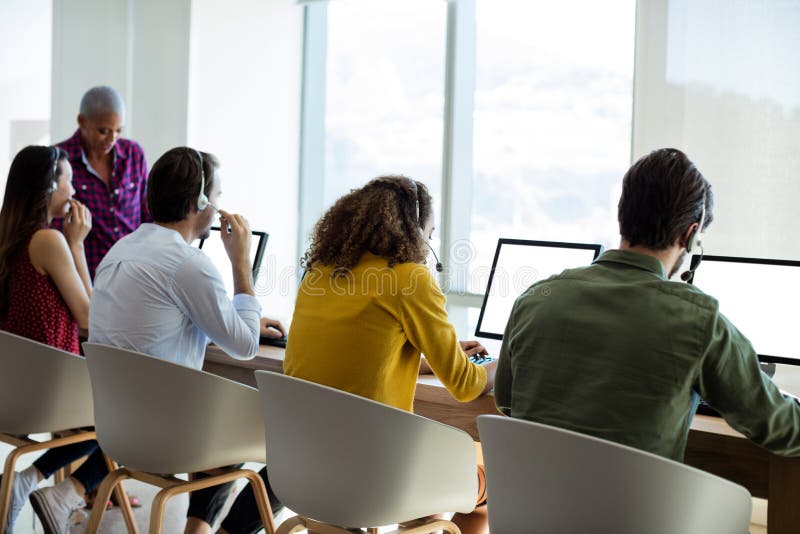 Customer Service Executive Talking on Headset Stock Photo - Image of ...