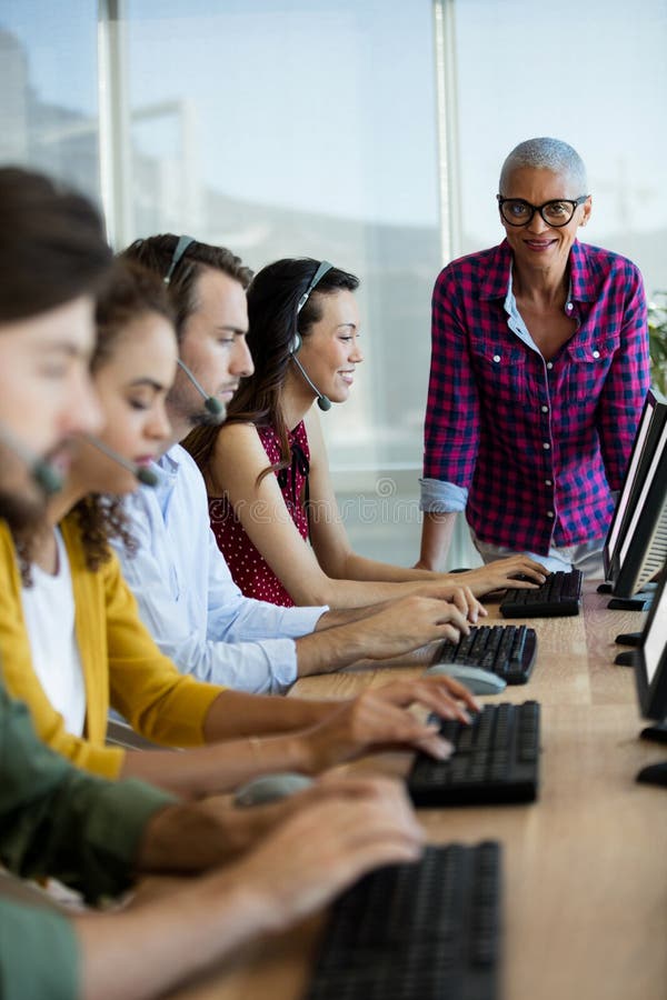 Customer Service Executive Trainer Assisting Her Team Stock Photo ...