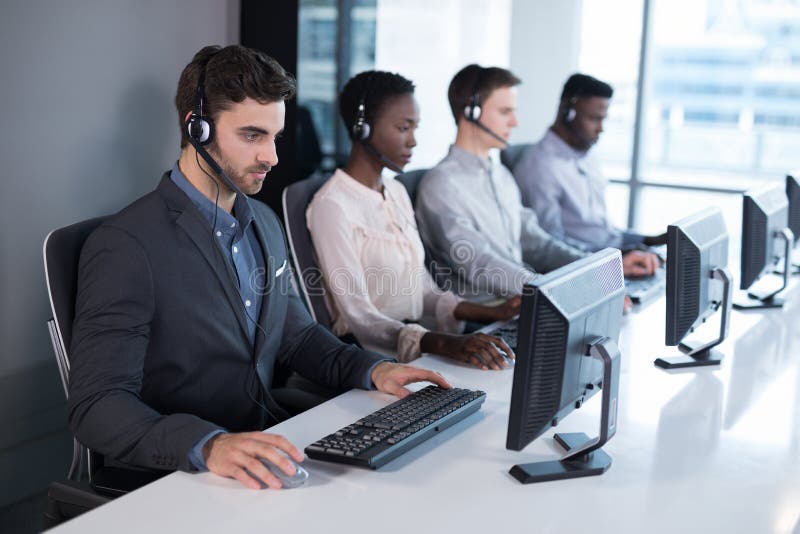 Customer Service Executives Working at Office Stock Photo - Image of ...