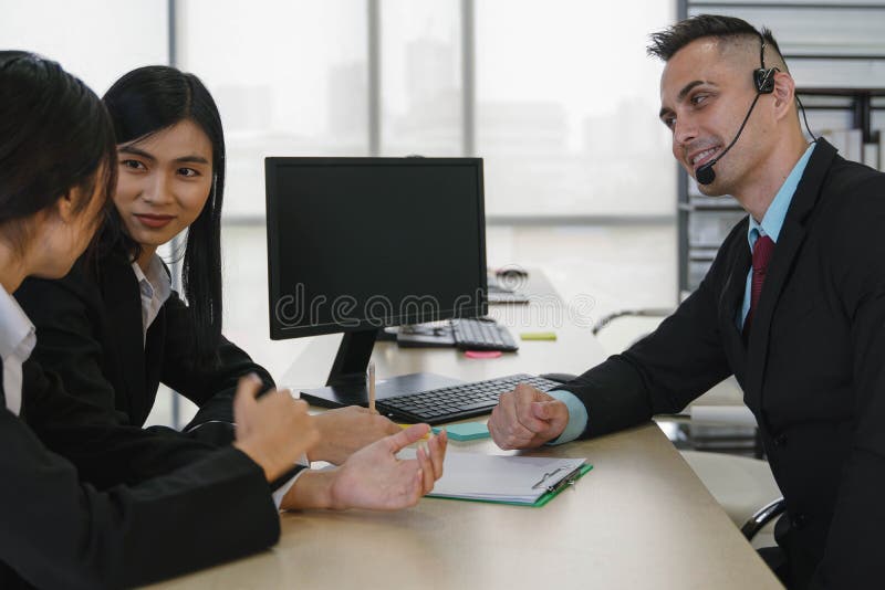 Customer Service and Help Desk Agent Talking with Customers Try To ...