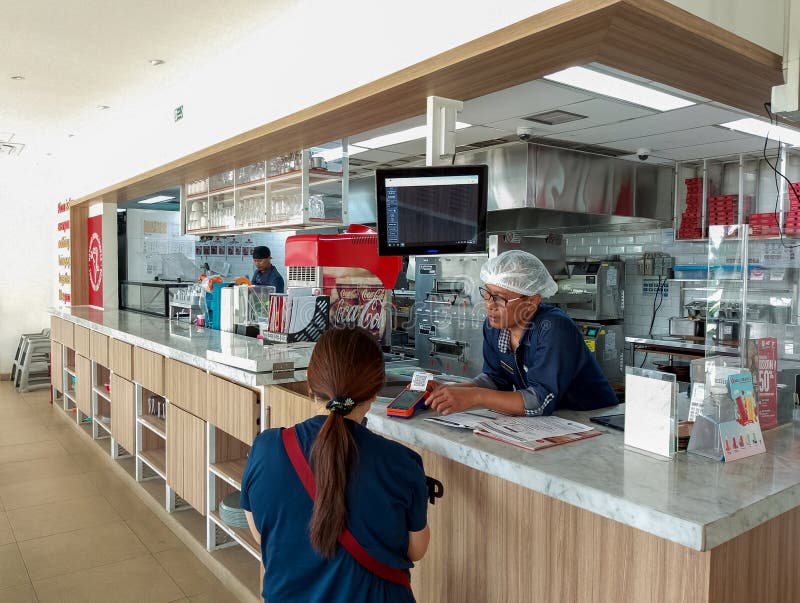 Customer Service Interaction at a Modern Fast Food Restaurant Counter ...