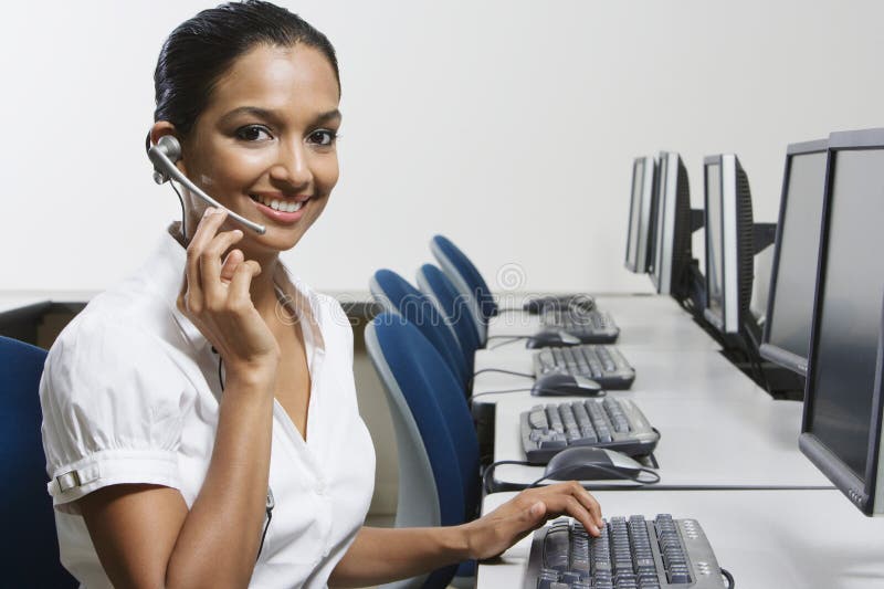 Friendly Customer Service Rep Stock Photo - Image of typing, desk: 2394330
