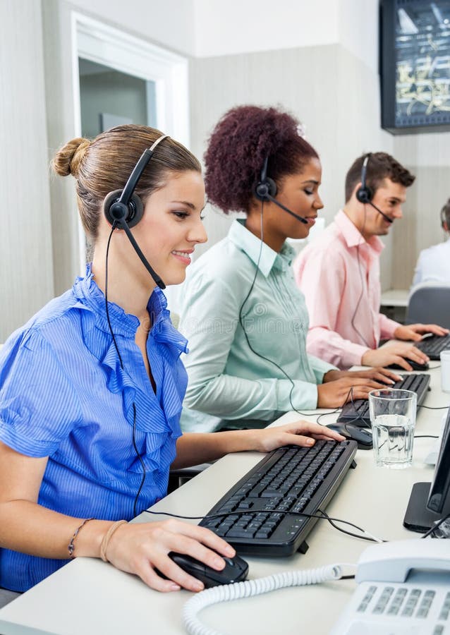 Customer Service Representatives Using Computers Stock Photo - Image of ...