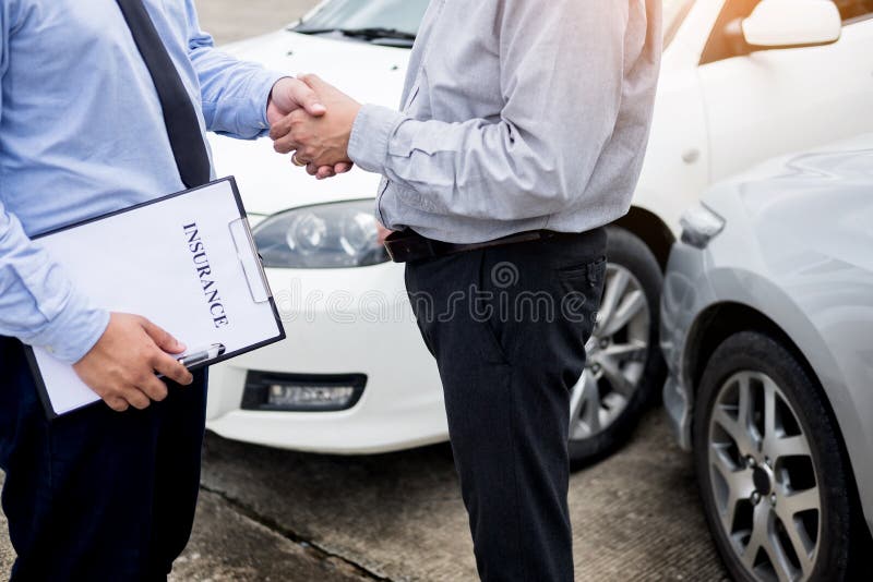 Customer Shake Hand with Auto Insurance Agents after Agreeing To Stock ...
