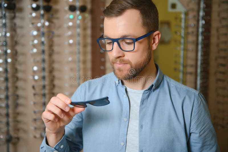 Customer Shoosing Spectacles at Optic Store. Stock Photo - Image of ...