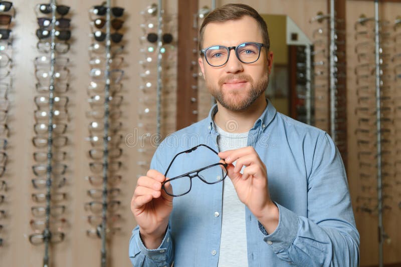 Customer Shoosing Spectacles at Optic Store. Stock Image - Image of ...