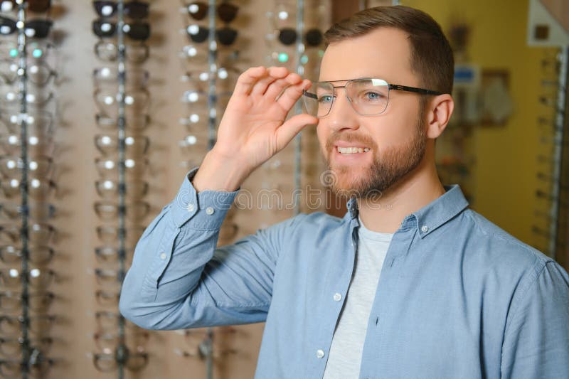 Customer Shoosing Spectacles at Optic Store. Stock Image - Image of ...