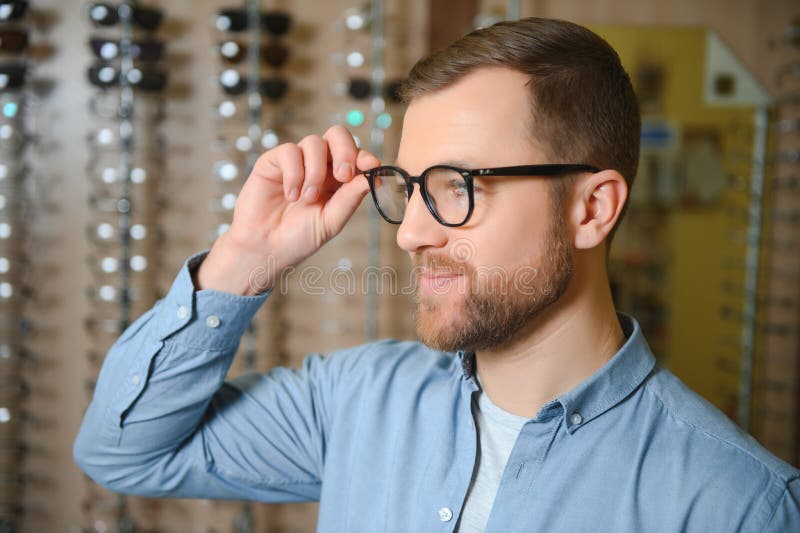 Customer Shoosing Spectacles at Optic Store. Stock Image - Image of ...