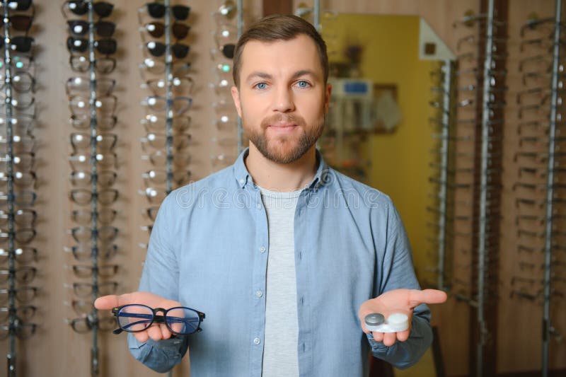 Customer Shoosing Spectacles at Optic Store. Stock Photo - Image of ...