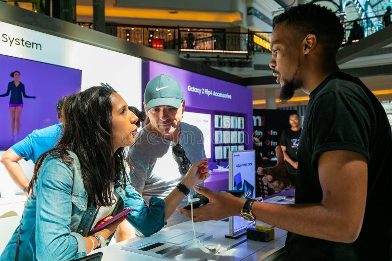 Customer Shopping for Mobile Phone in Retail Store. Editorial ...