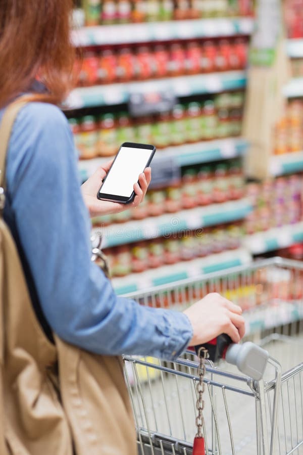 Customer in a Store with a Smartphone Stock Image - Image of aisle ...