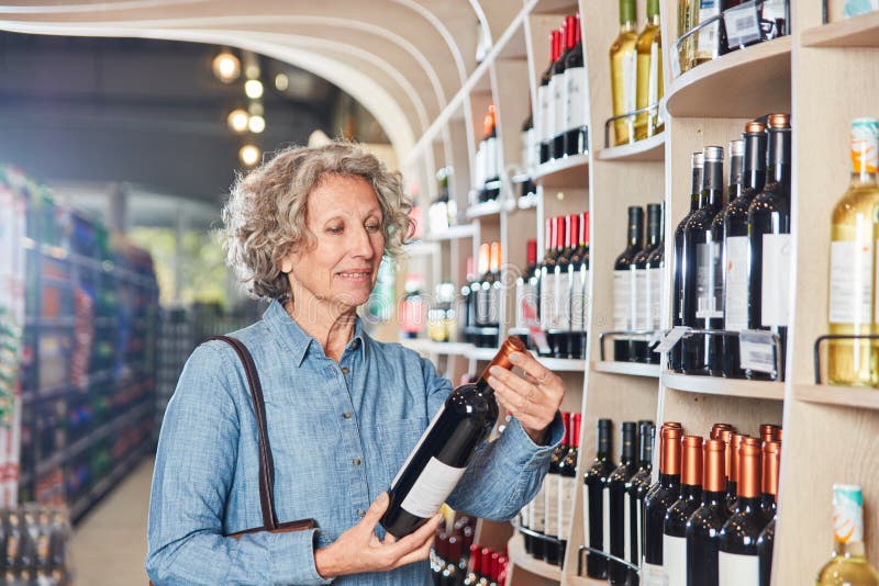 Customer in the Supermarket with a Bottle of Red Wine Stock Image ...
