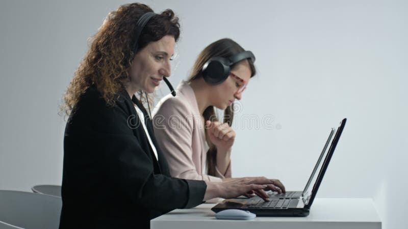 Customer Support Agent or Call Center with Headset Works on Desktop ...