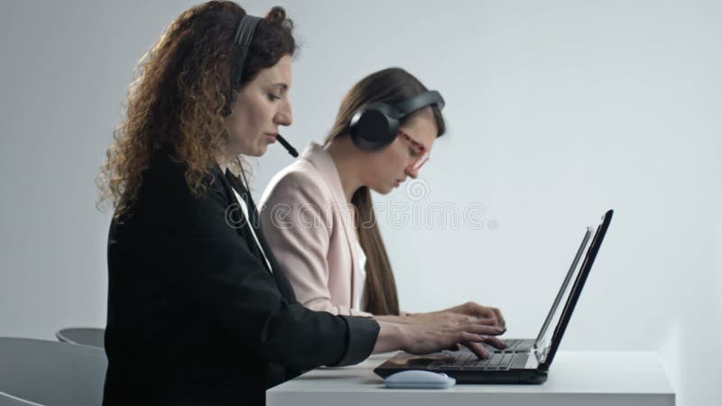 Customer Support Agent or Call Center with Headset Works on Desktop ...