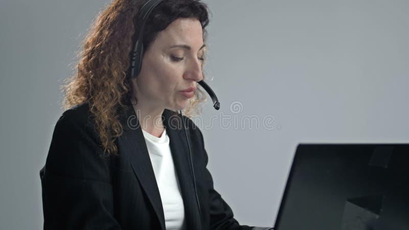 Customer Support Agent or Call Center with Headset Works on Desktop ...