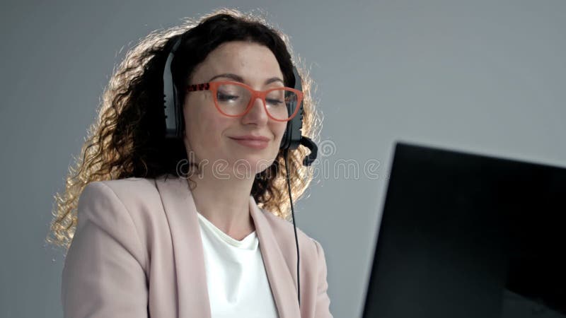 Customer Support Agent or Call Center with Headset Works on Desktop ...