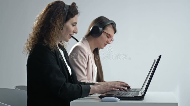 Customer Support Agent or Call Center with Headset Works on Desktop ...