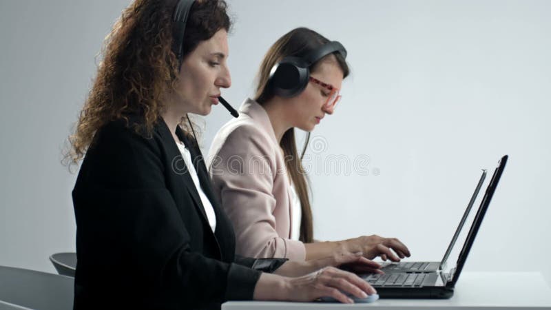 Customer Support Agent or Call Center with Headset Works on Desktop ...