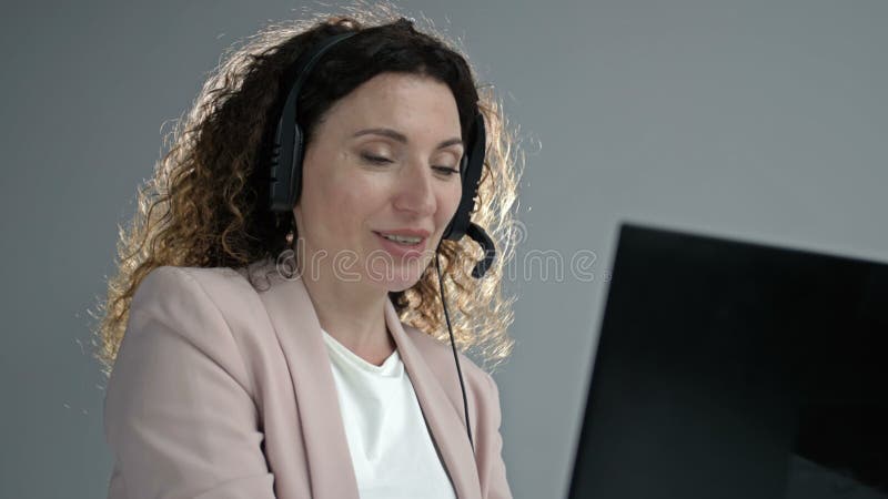 Customer Support Agent or Call Center with Headset Works on Desktop ...