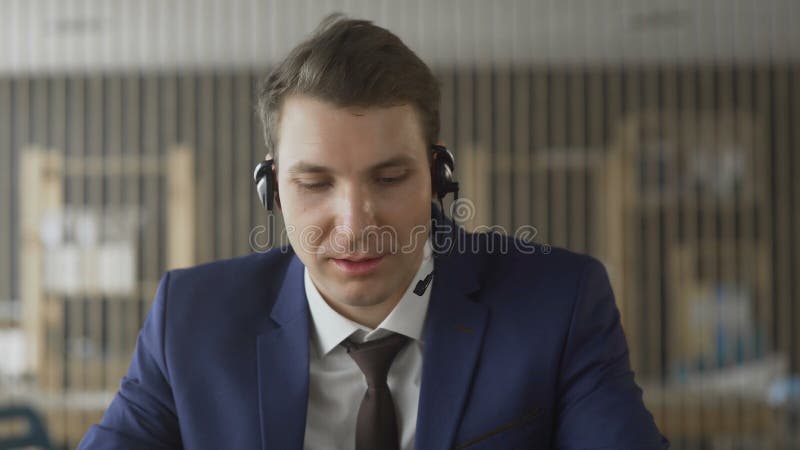 Customer Support Agent with Headphones and Microphone in Modern Office ...