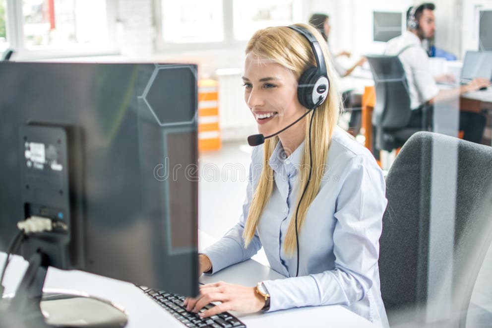 Customer Support Agent Talking with Client and Using Computer in Call ...
