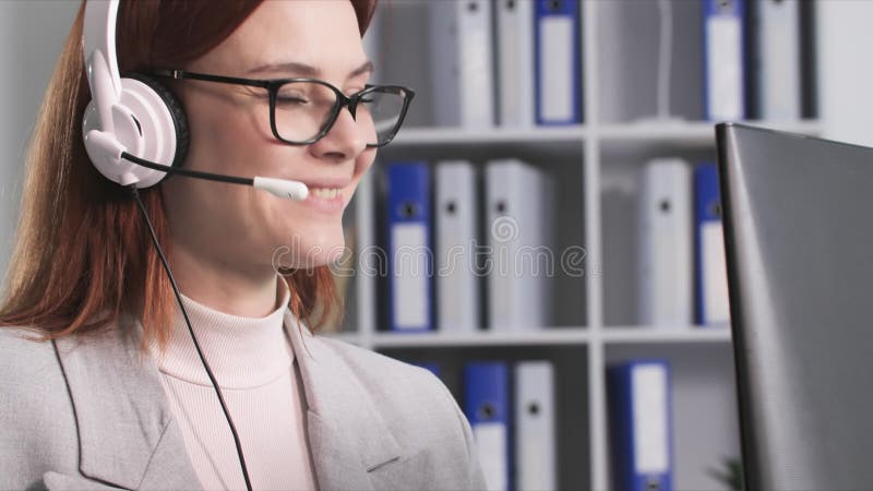 Customer Support, Charming Woman in Glasses Talking Using a Headset ...
