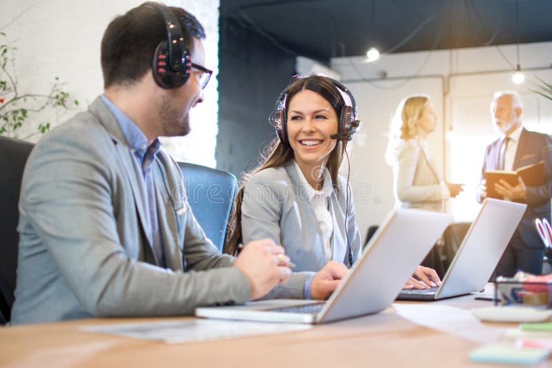 Customer Support Operators Working on Laptops in Modern Office. Stock ... Customer Support Operators Working on Laptops in Modern Office. Stock ...