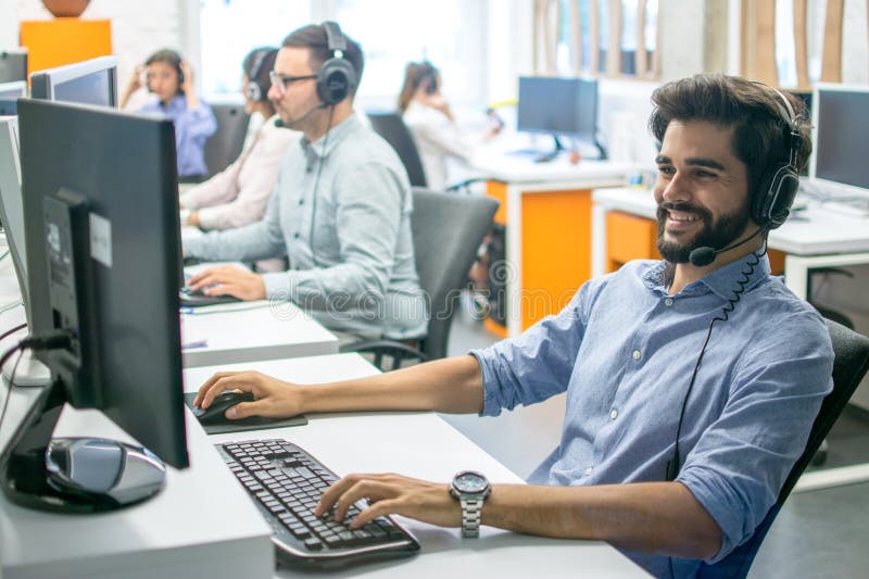 Customer Support Operators Working Together in Call Center. Stock Photo ...