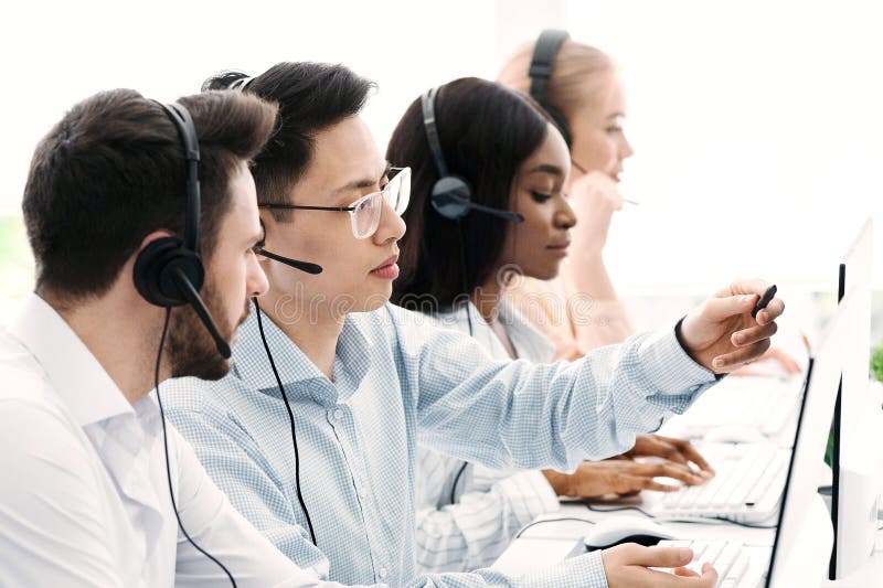 Customer Support Service. Hotline Operator Helping His Colleague at ...