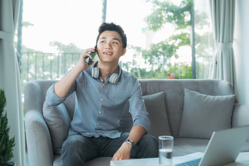 Customer Support. Smiling Man Using Laptop Talking on Phone with Call ...