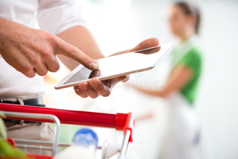Customer With Tablet At Supermarket Stock Photo - Image of choosing ...