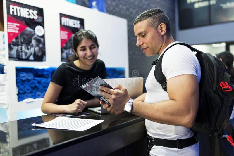 Customer Talking about Fitness Membership with the Staff Stock Photo ...