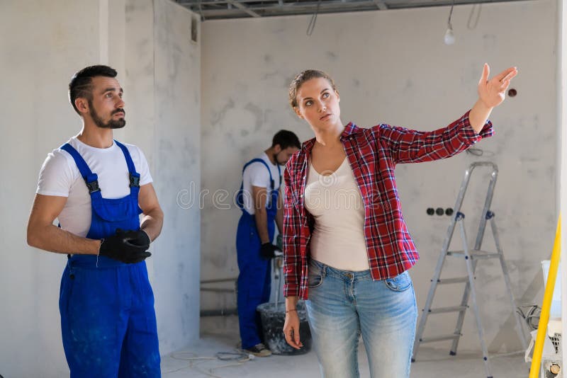 The Client Tells the Builder How To Make Repairs Stock Image - Image of ...