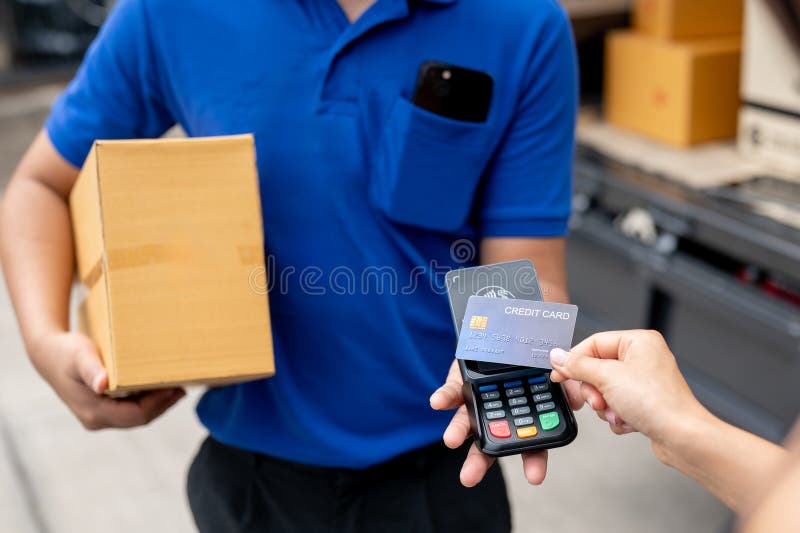 A Customer Tapping Her Credit Card on a Card Reader before Receiving a ...