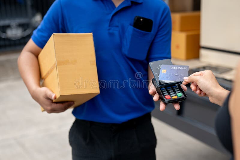 A Customer Tapping Her Credit Card on a Card Reader before Receiving a ...
