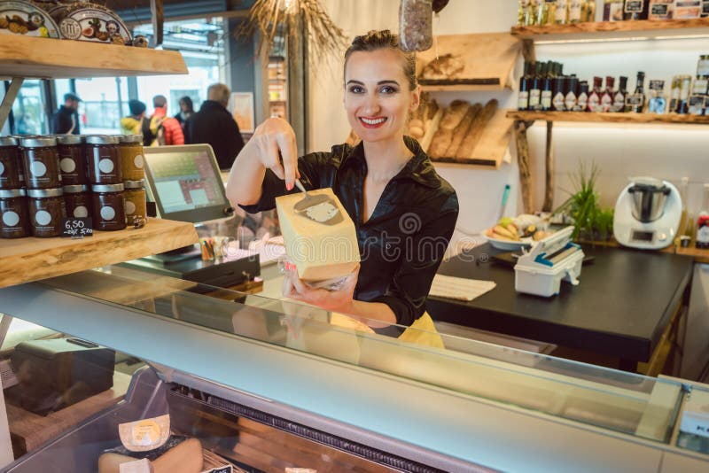Customer Trying Bit of Cheese at the Deli Counter Stock Photo - Image ...