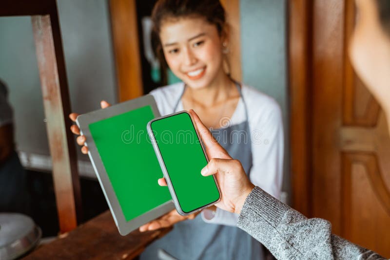 Customer Using a Blank Cell Phone To Scan Blank Pad Stock Photo - Image ...
