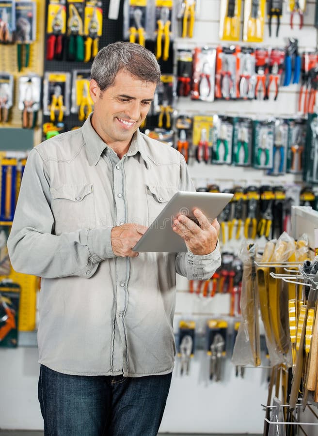 Customer Using Digital Tablet in Hardware Store Stock Image - Image of ...