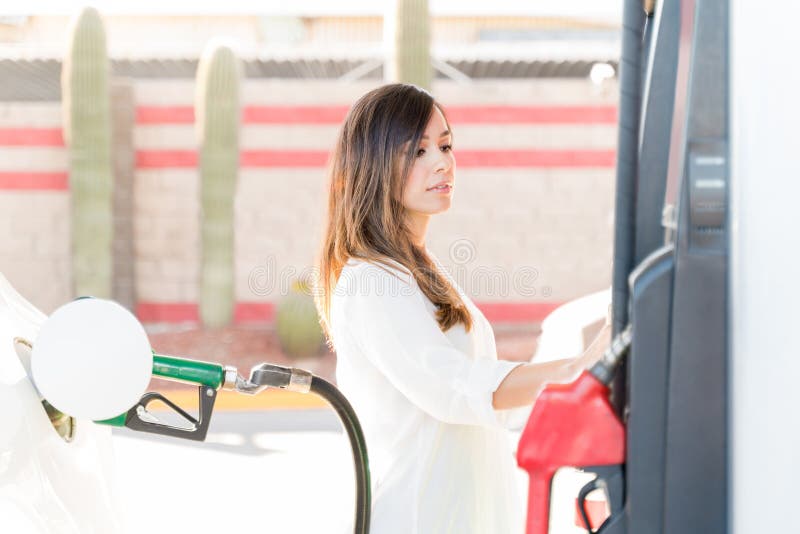 Customer Using Fuel Pump at Gas Station Stock Photo - Image of side ...