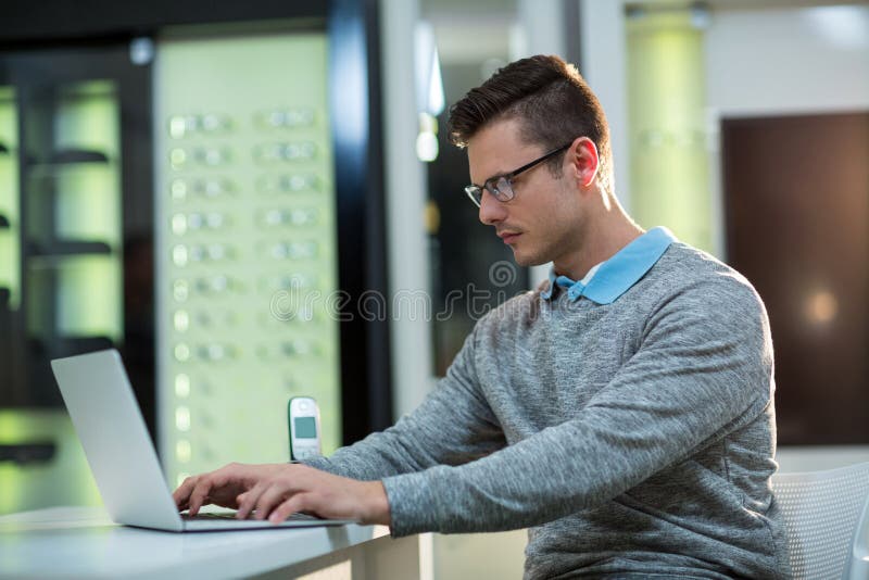 Customer Using Laptop in Optical Store Stock Photo - Image of sitting ...