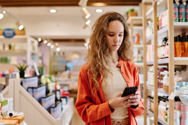 Customer Using Smartphone in the Store Stock Image - Image of young ...