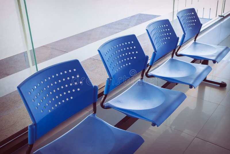 Customer Waiting Area with Rows of Blue Seats Stock Photo - Image of ...