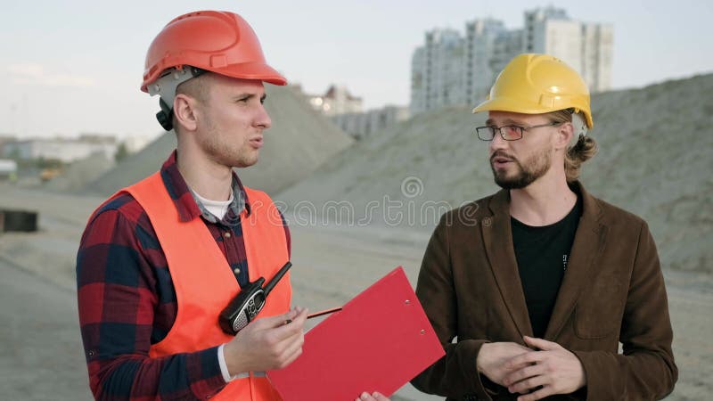 Customer Work with Supervisor at Construction Site Outside Stock ...