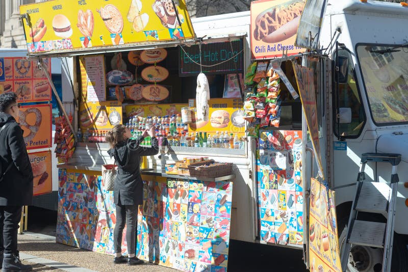 Customers Buy Food from the Owner in a Van in Front of a Building in ...