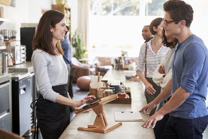 Customers at a Coffee Shop Queuing To Order and Pay Stock Image - Image ...