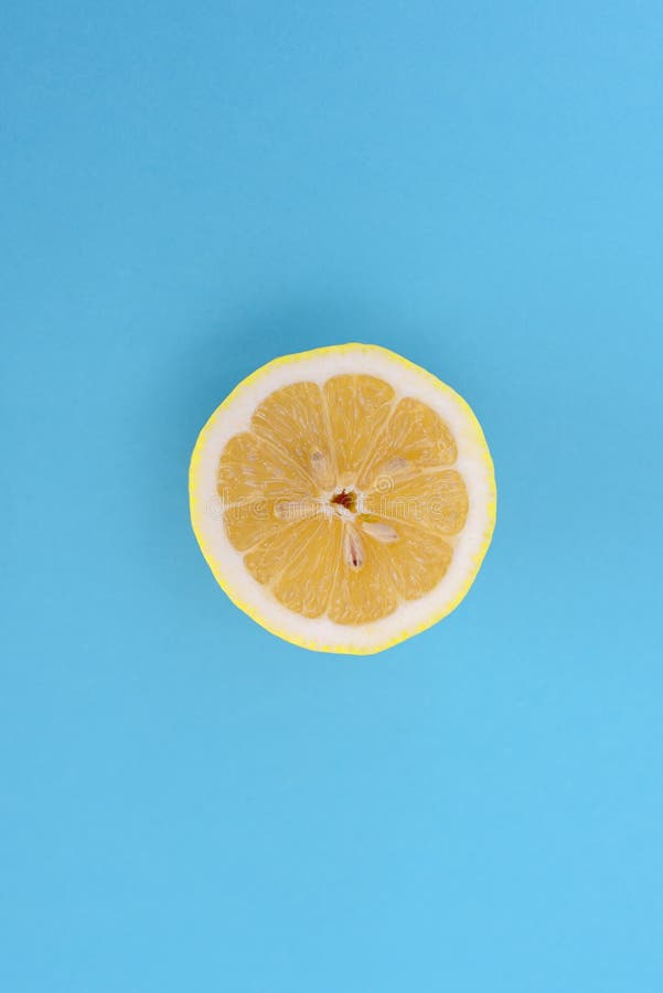 Cut Across a Ripe Yellow Lemon on a Blue Background Stock Photo - Image ...