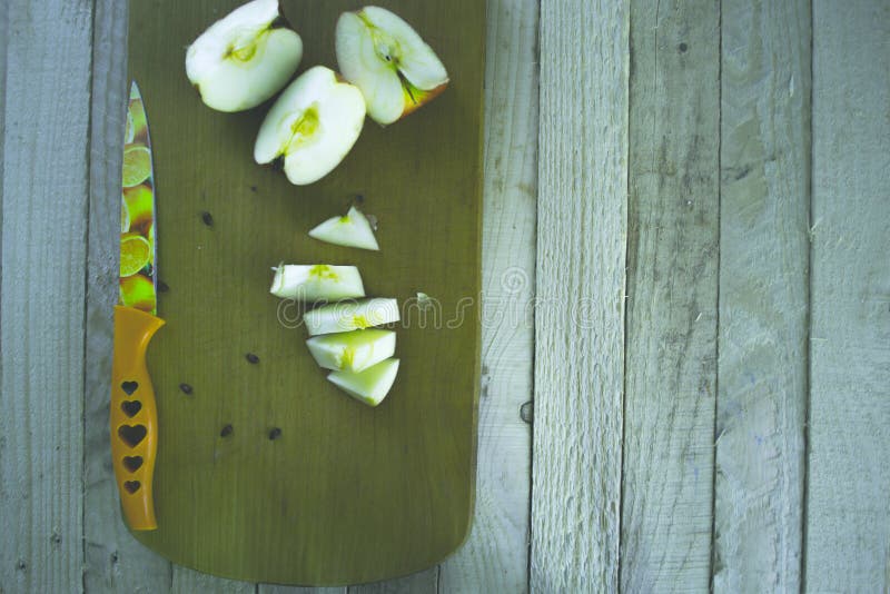 Cut Apples on a Wooden Background. Stock Photo - Image of board, space ...