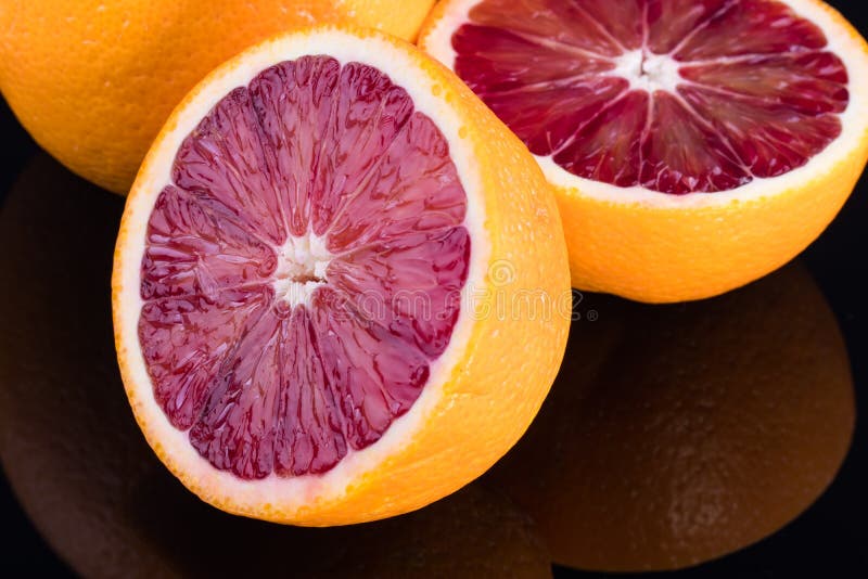 Cut Blood Orange on a Black Background Stock Photo - Image of vivid ...